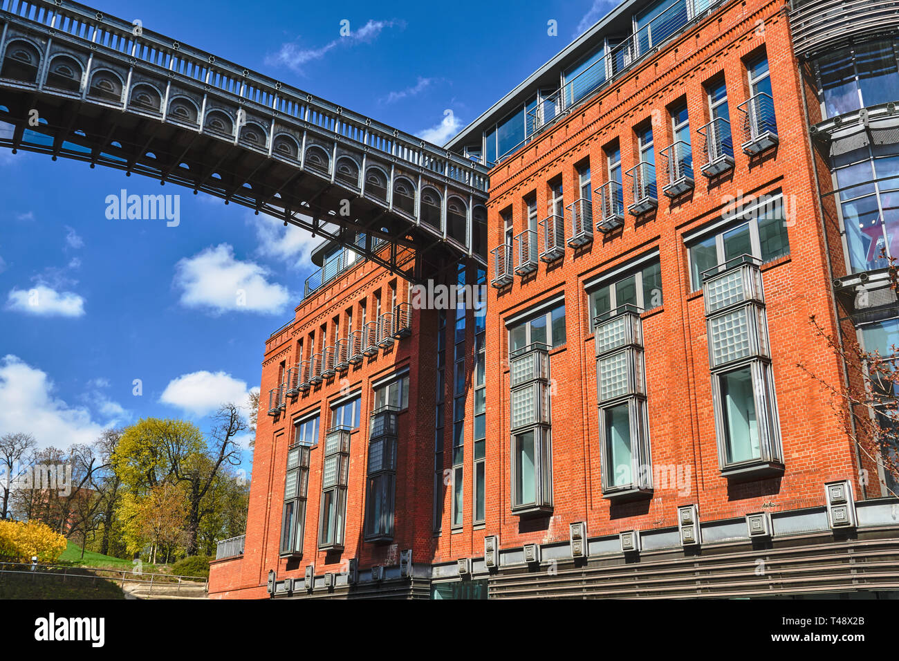 metal structure of footbridge and Red brick wall in an old brewery in ...