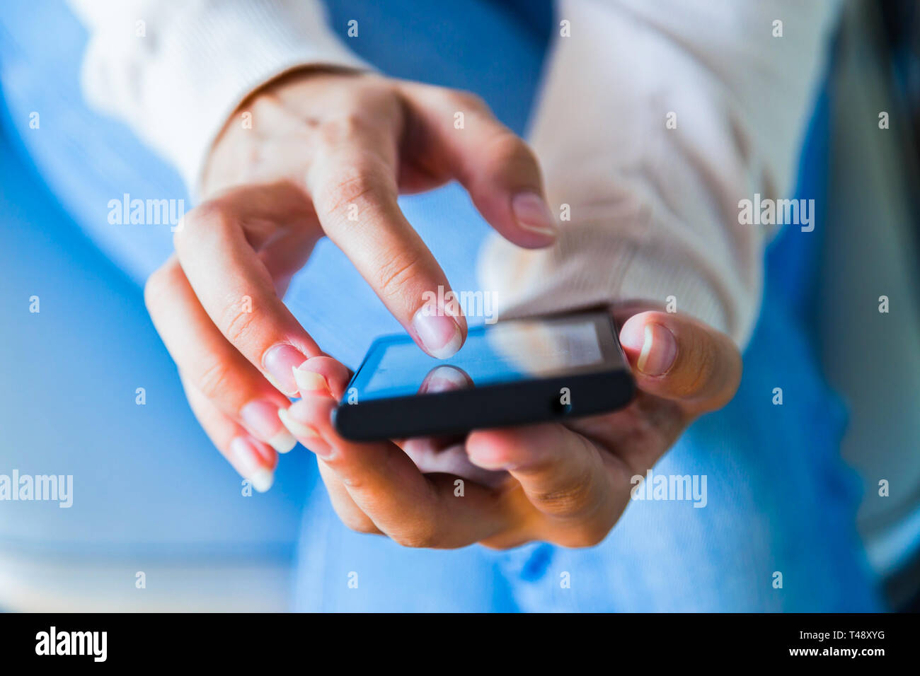 Close up of woman hands using cell phone Stock Photo - Alamy
