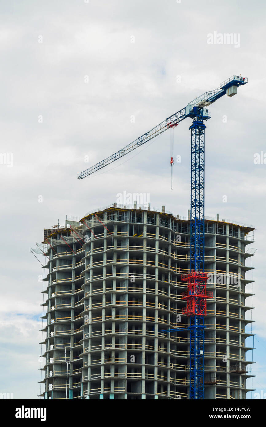 Machinery crane working in construction site building industry Stock ...