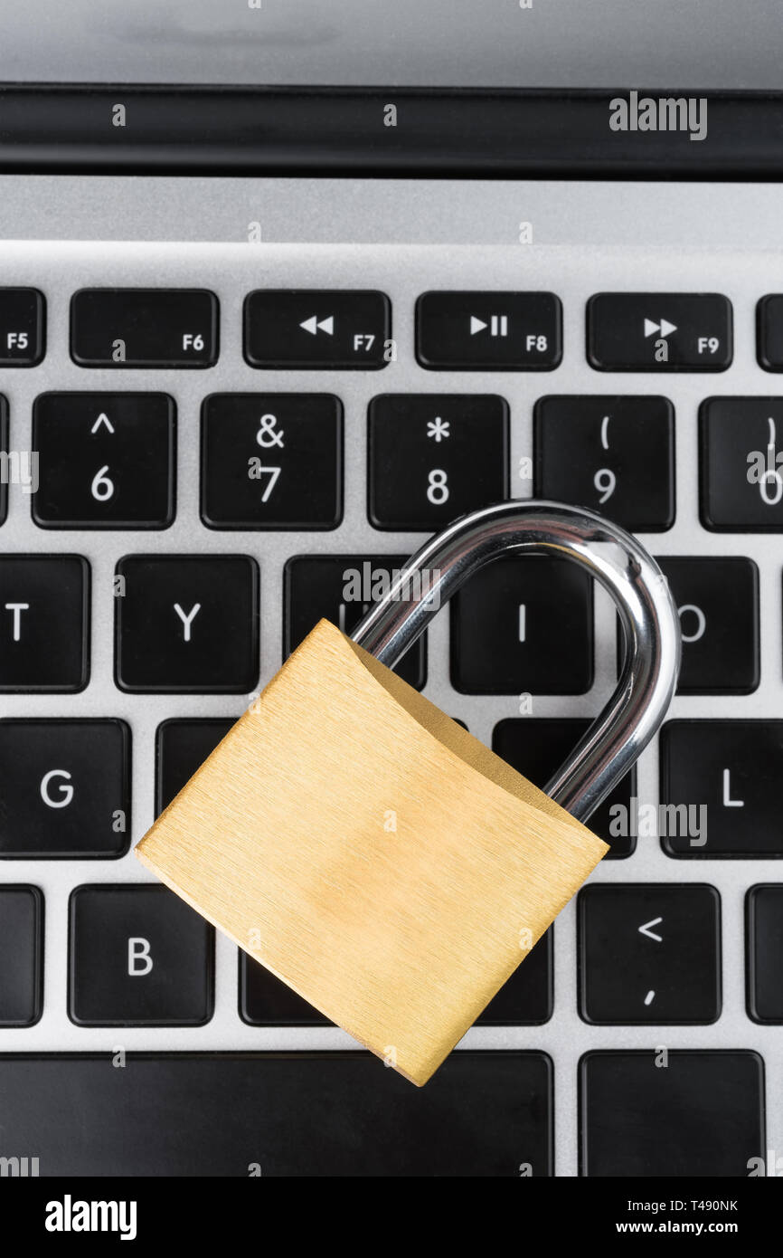 Padlock on a laptop computer keyboard. Cyber security abstract concept ...