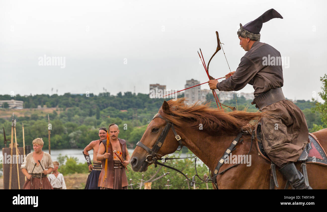 KHORTYTSIA, UKRAINE - JULY 03, 2018: Ukrainian Cossack archer horseman ...