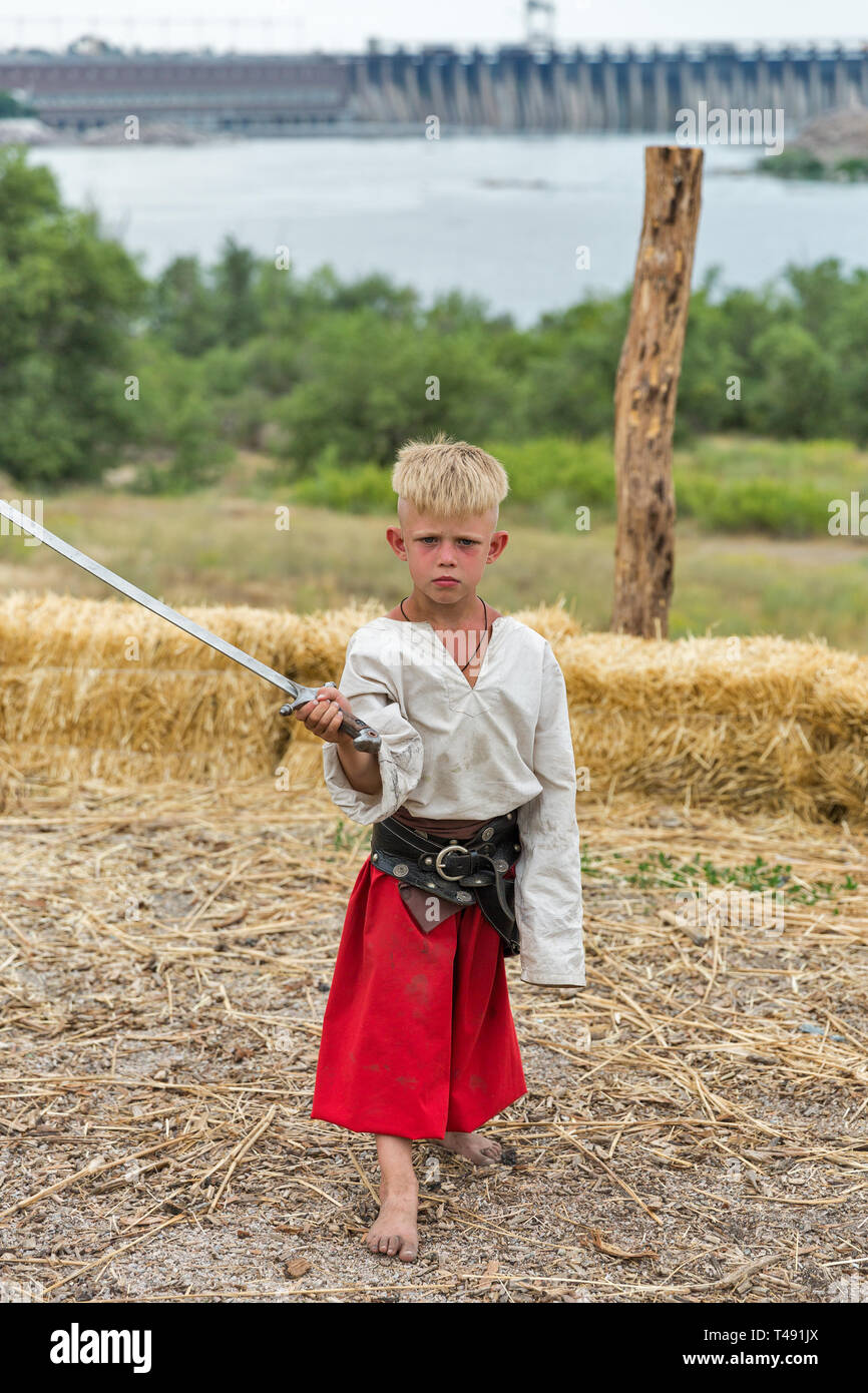 KHORTYTSIA, UKRAINE - JULY 03, 2018: Young boy Ukrainian Cossack with ...