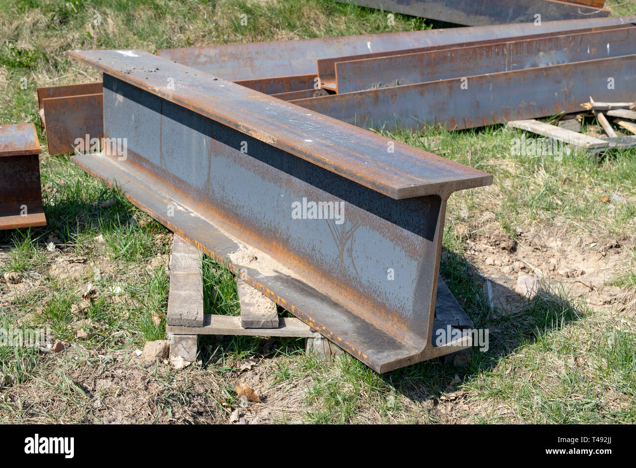 Large steel I-sections on the construction site. Poorly stored building ...