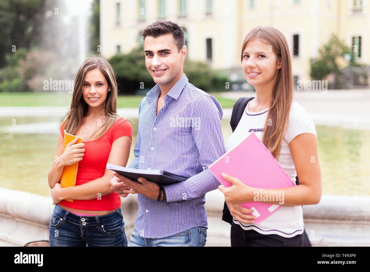Outdoor portrait of a smiling students Stock Photo - Alamy
