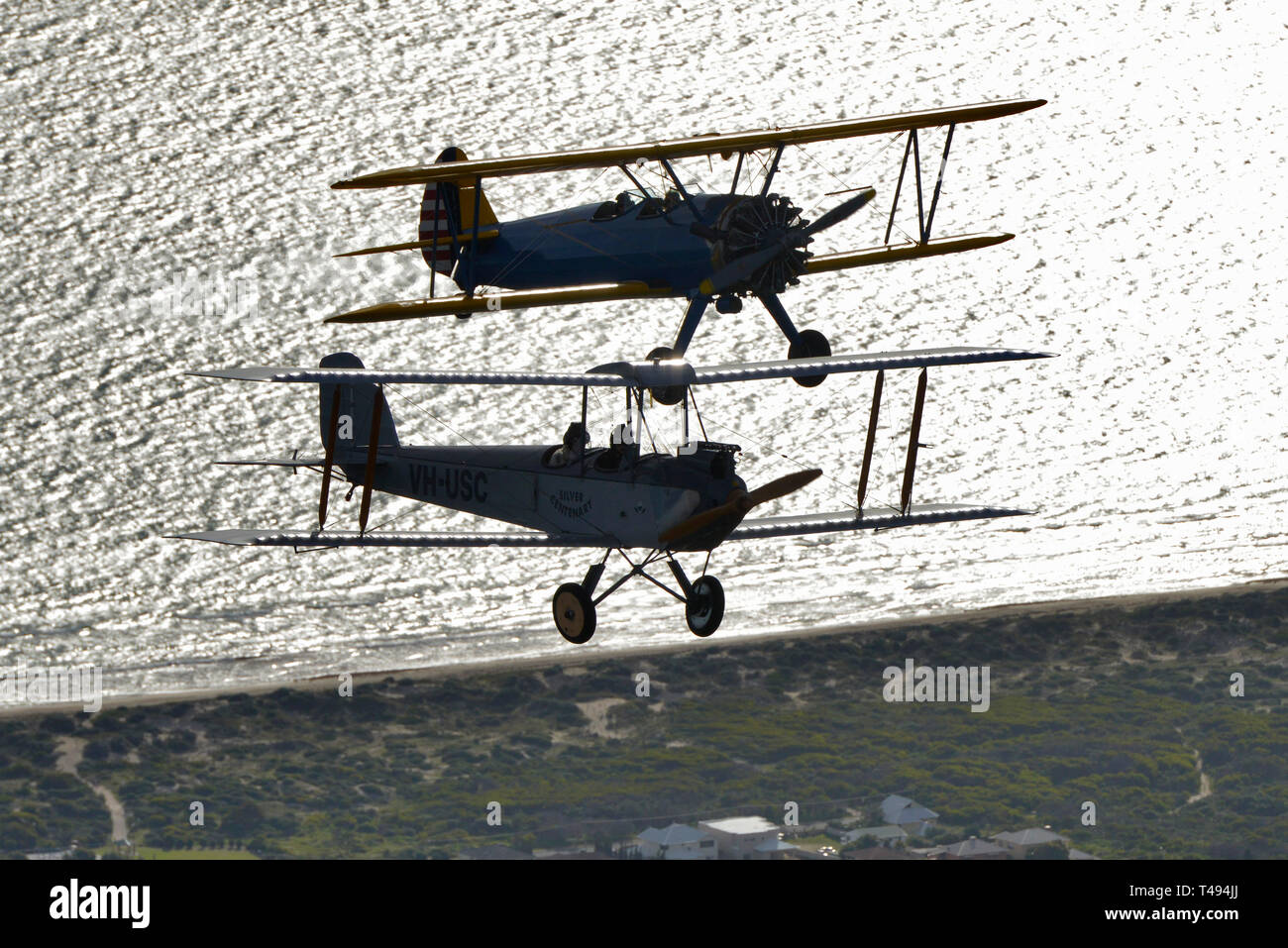 Silhouetted view of the one and only Silver Centenary biplane in ...