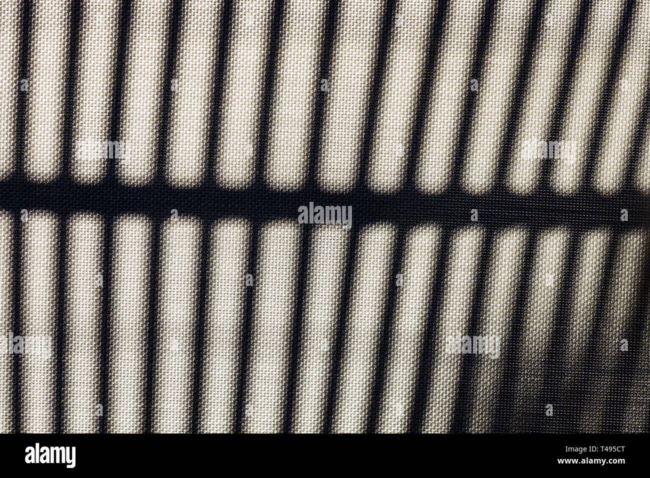 Structure pattern shadow cast over detailed material Stock Photo - Alamy