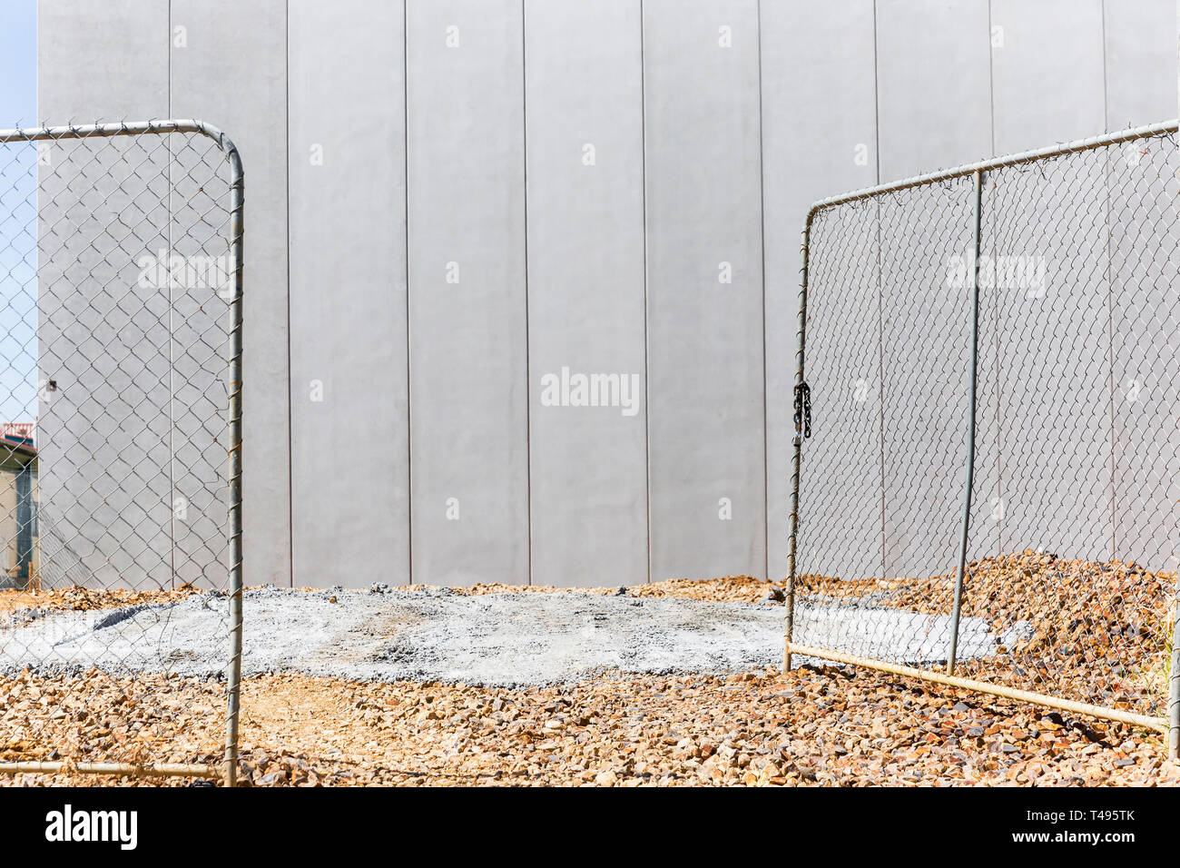 Open gates on newly developed construction site Stock Photo - Alamy