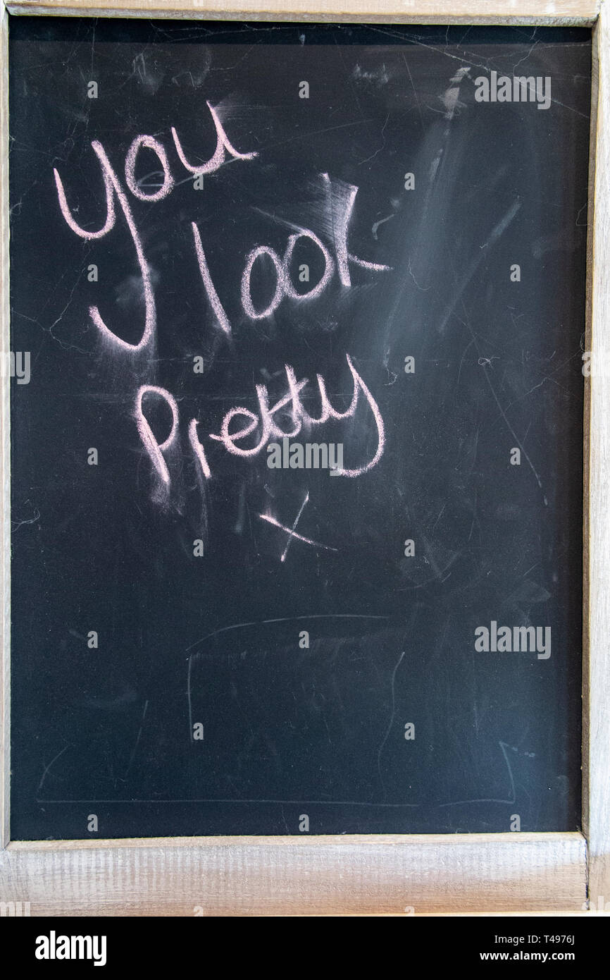 A positive message on a blackboard - you look pretty Stock Photo - Alamy