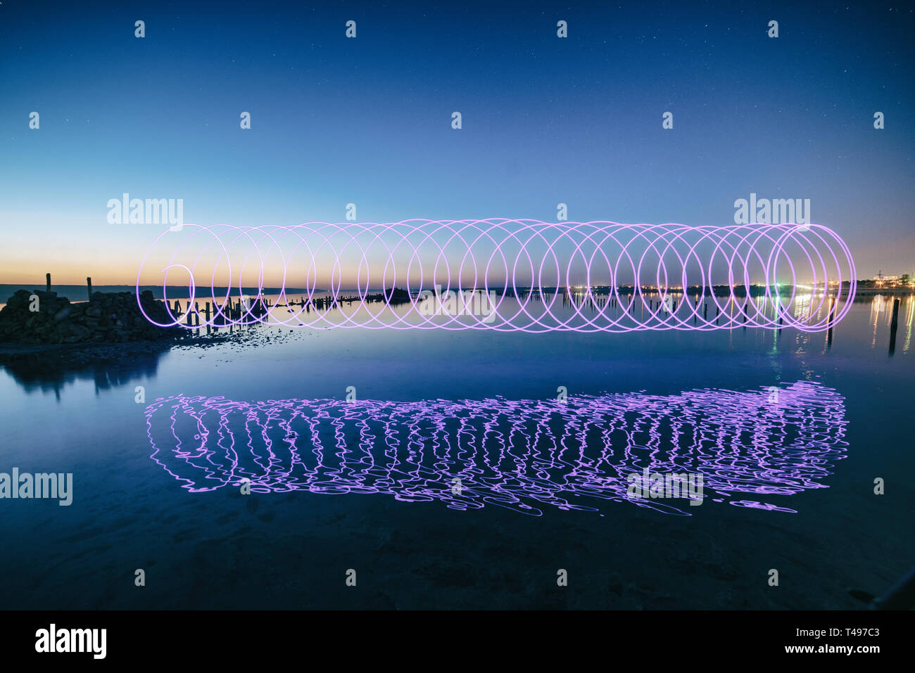 Amazing laser fireshow performance in the night blue sky with ...