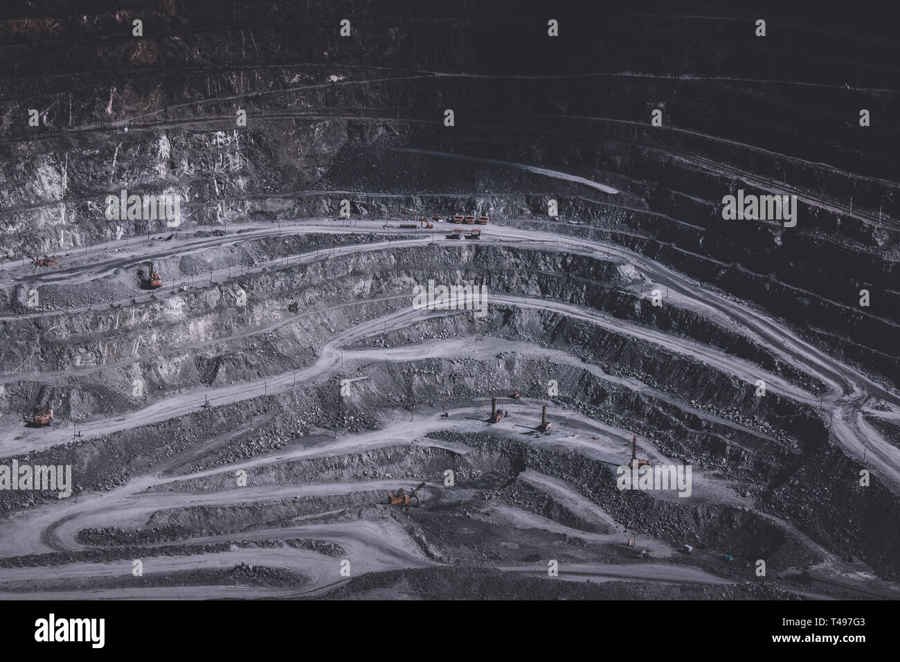 Aerial view industrial of opencast mining quarry with lots of machinery ...