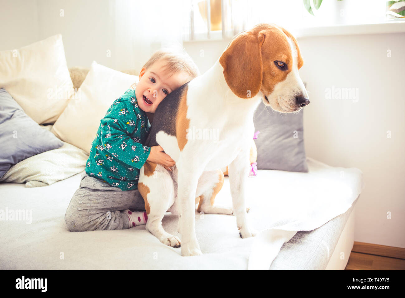 Baby Hugging Dog