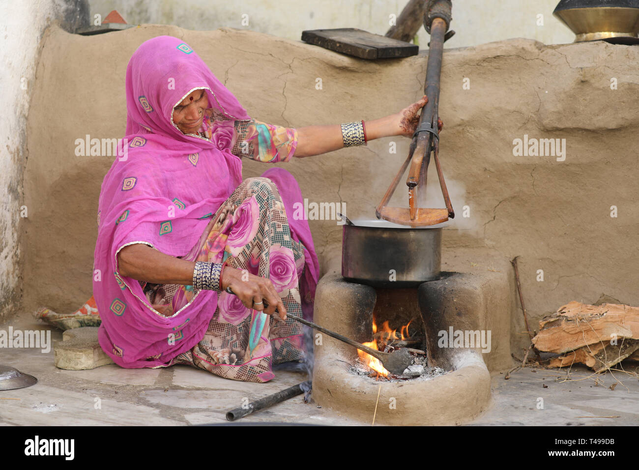 Indian Rajasthani woman cooking chapati --- chapatti indian bread ...