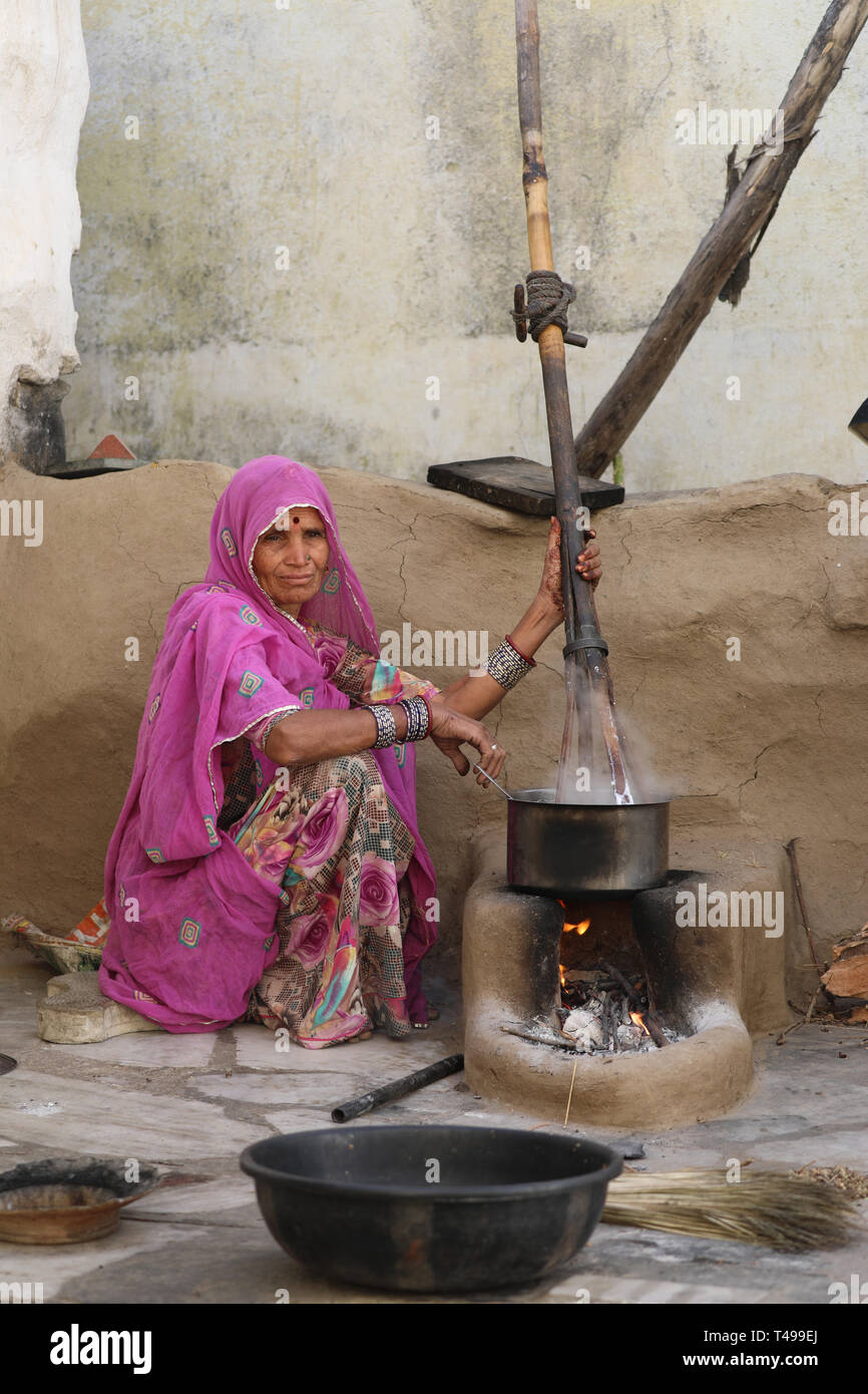 Indian Rajasthani woman cooking chapati --- chapatti indian bread ...