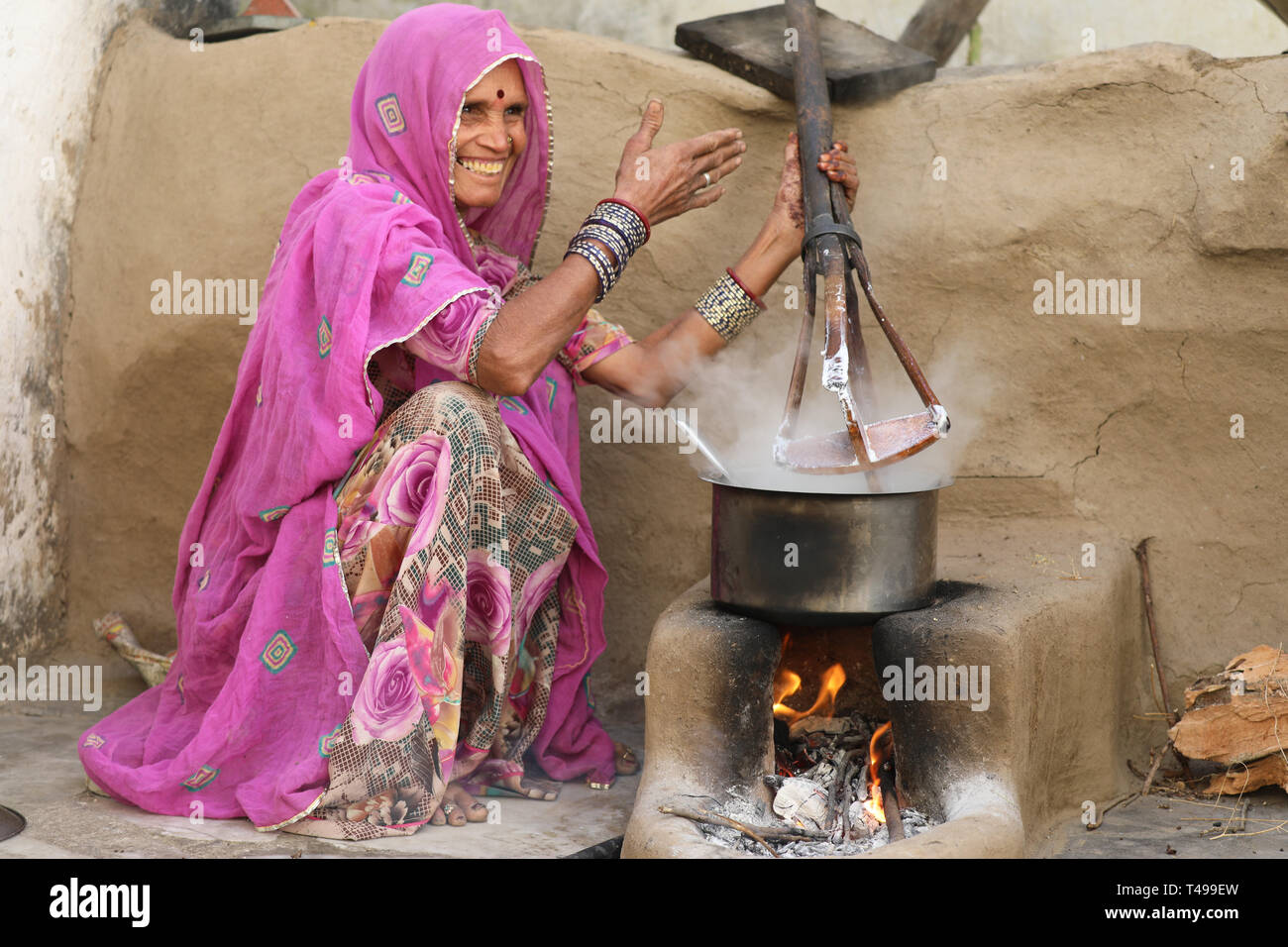 Indian Rajasthani woman cooking chapati --- chapatti indian bread ...