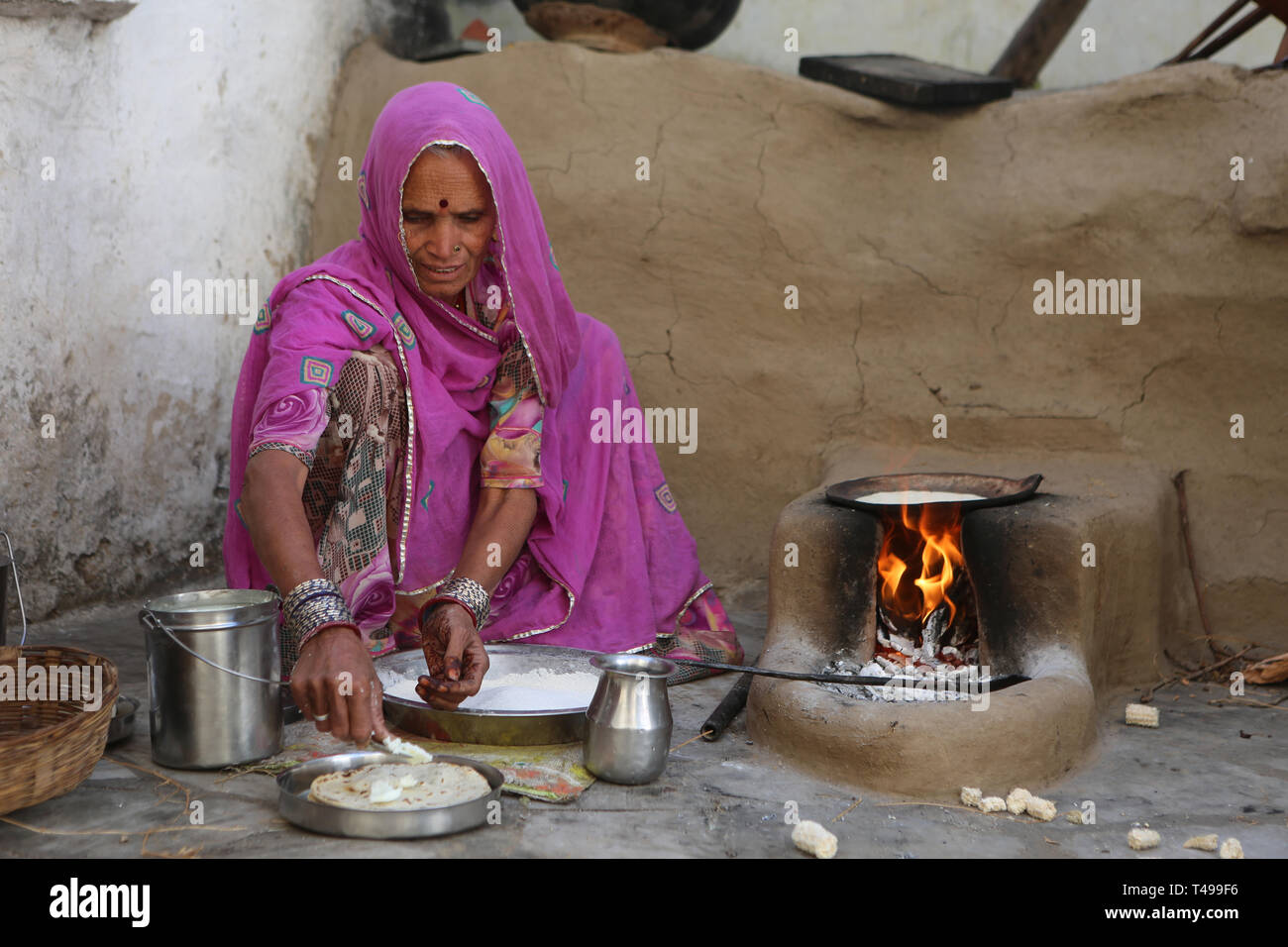 Indian Rajasthani woman cooking chapati --- chapatti indian bread ...