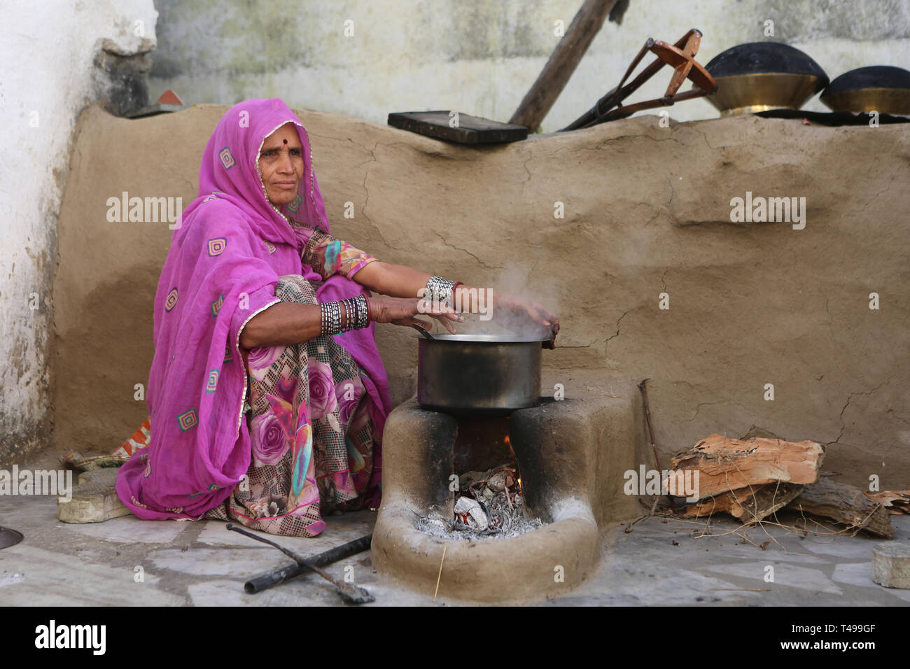 Indian Rajasthani woman cooking chapati --- chapatti indian bread ...