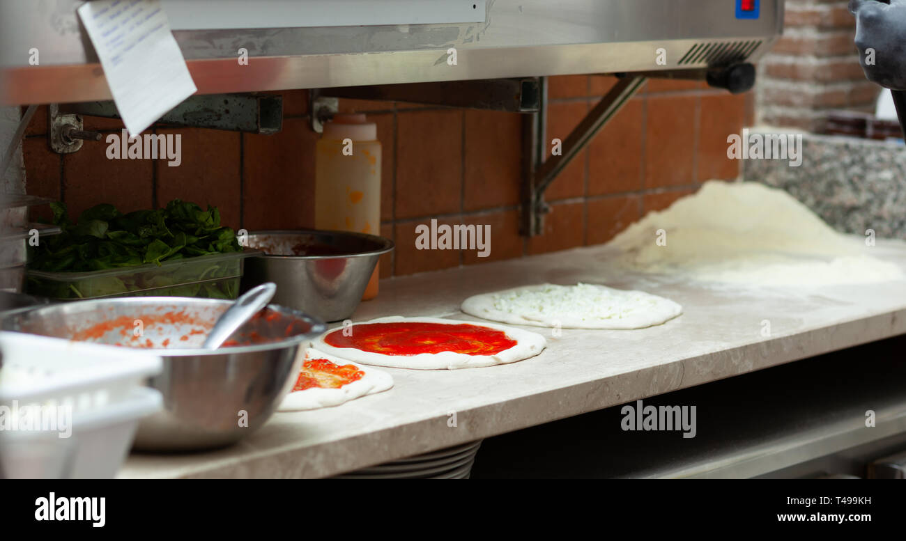 Marble top with ingredients for the preparation of Neapolitan pizza ...