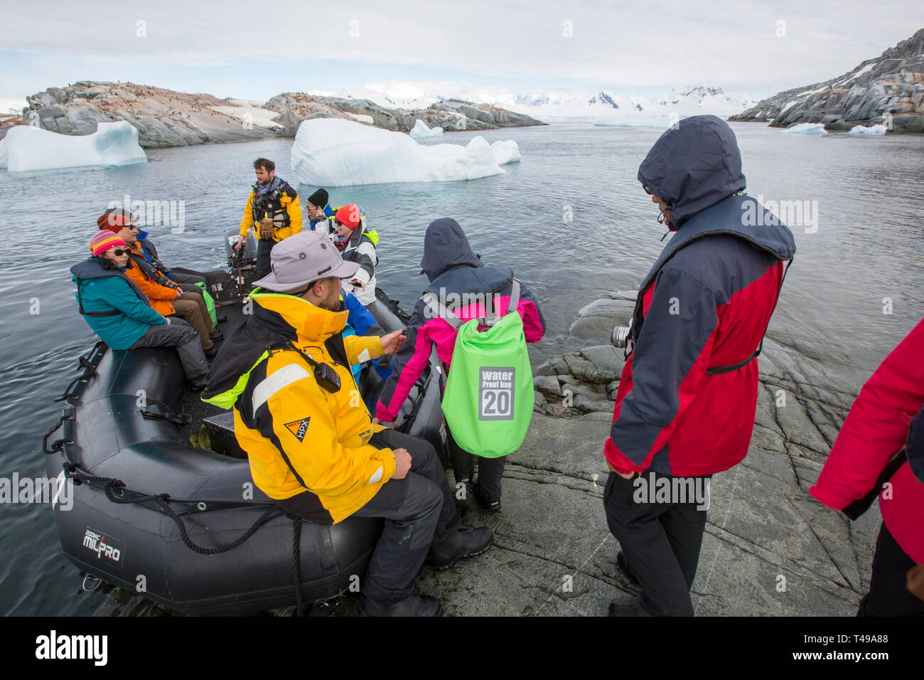 Useful Island on the Antarctic Peninsular with tourists landing in a ...