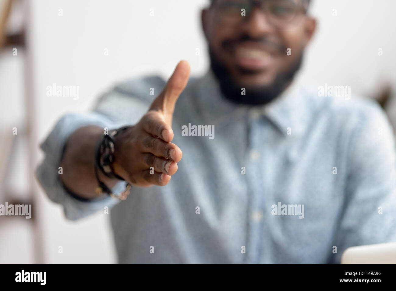 African professional businessman recruiter consultant extending hand at ...