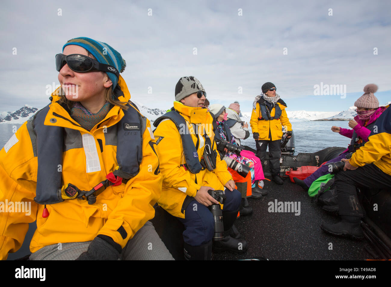 Useful Island on the Antarctic Peninsular with tourists in a zodiac ...