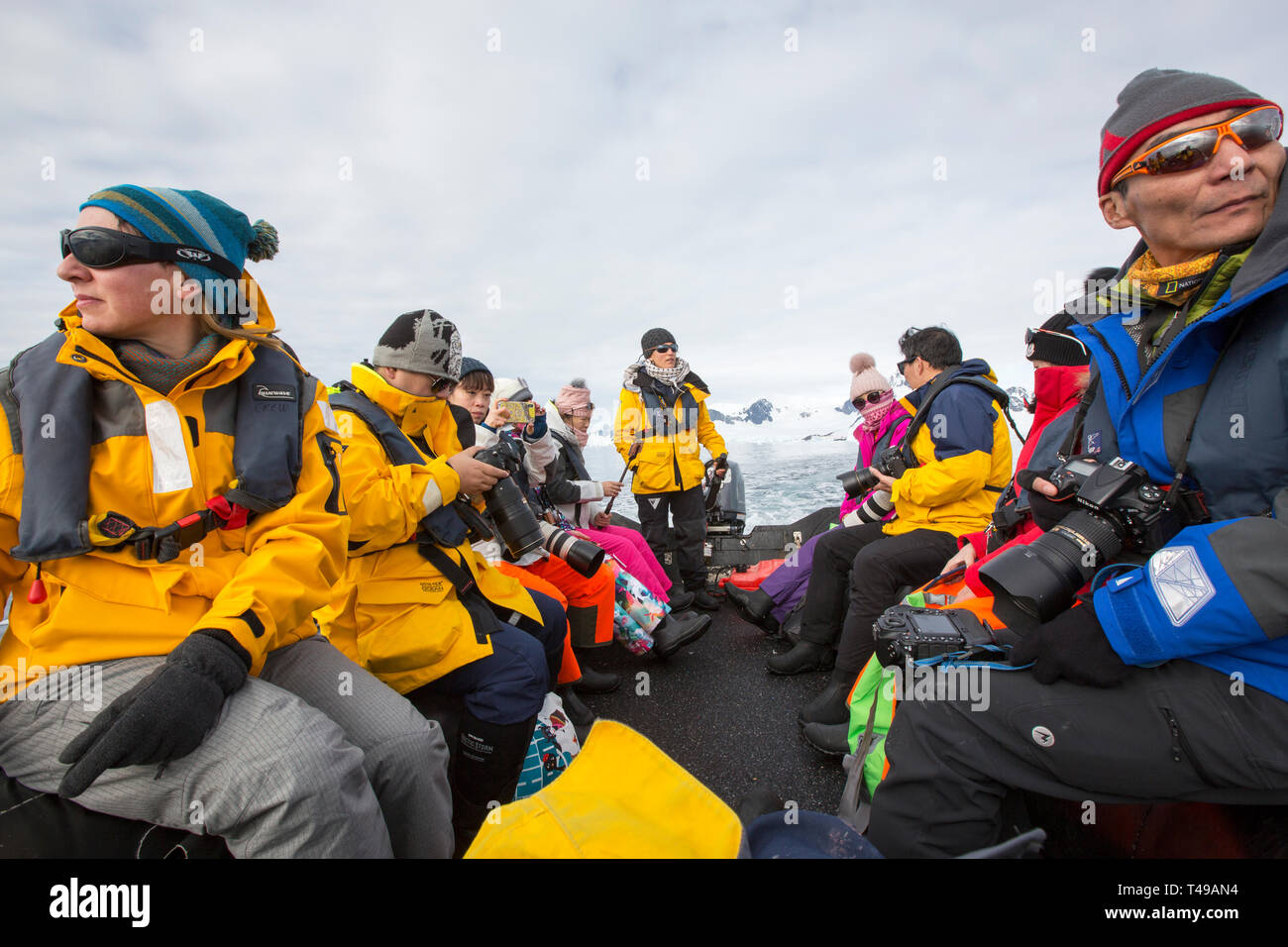 Useful Island on the Antarctic Peninsular with tourists in a zodiac ...