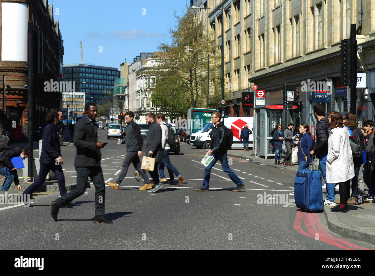 People crossing the crosswalk in Commercial street, Shoreditch, East ...