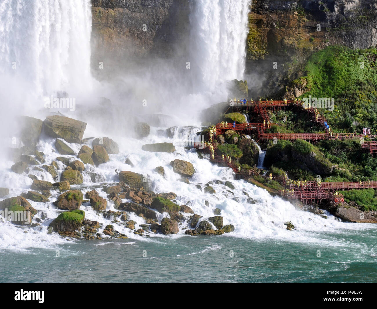 Tourists visiting the American Falls Niagara Falls, United States Cave ...
