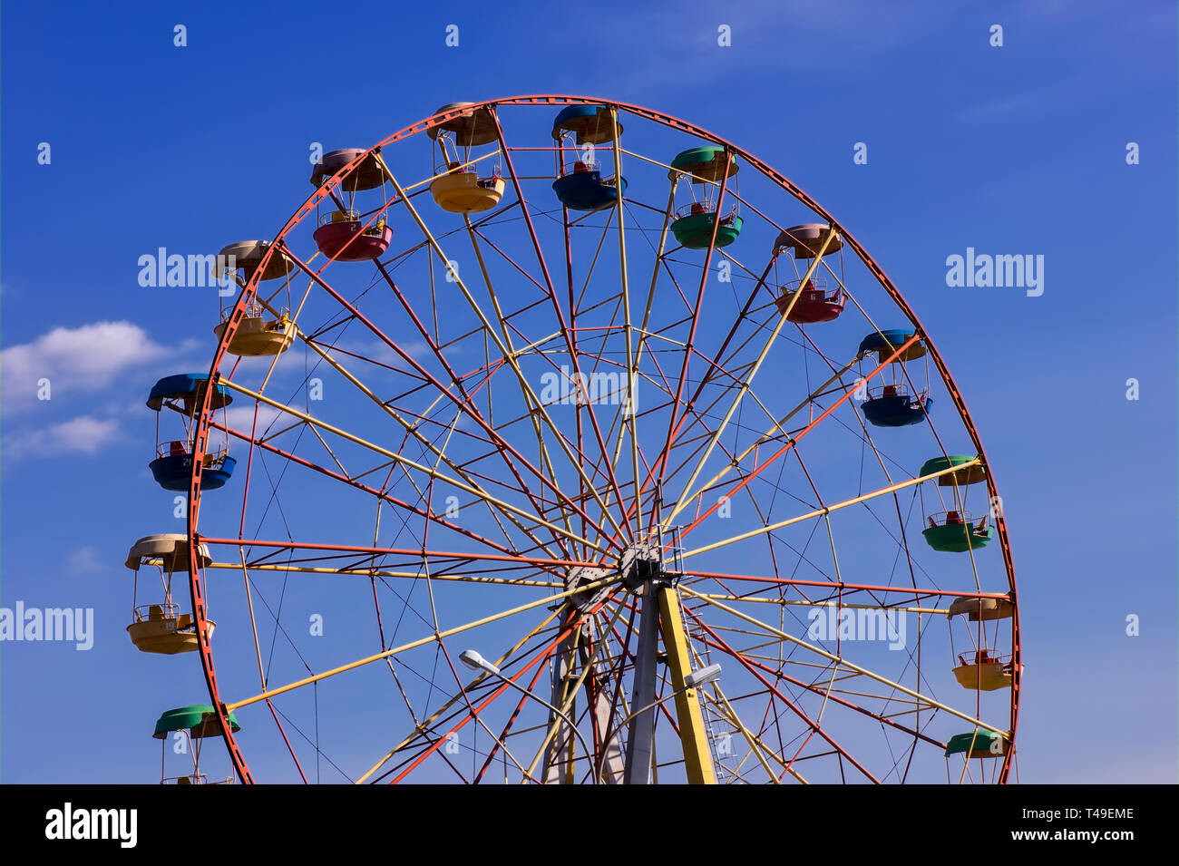 Ferris wheel in the park against blue spring sky Stock Photo - Alamy