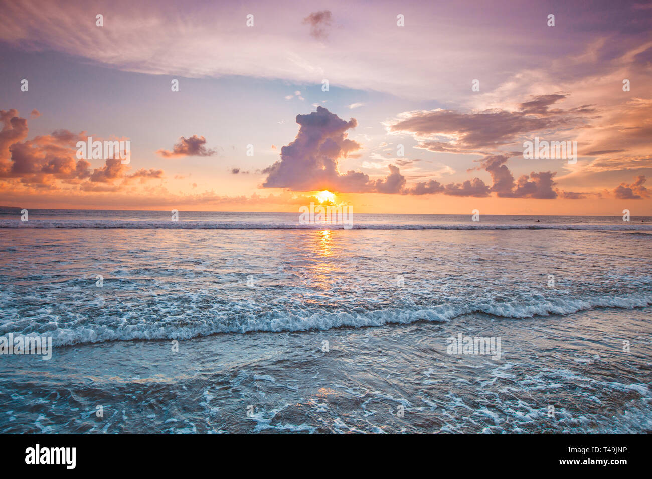 Amazing colorful sunset over sea form Bali beach Stock Photo - Alamy
