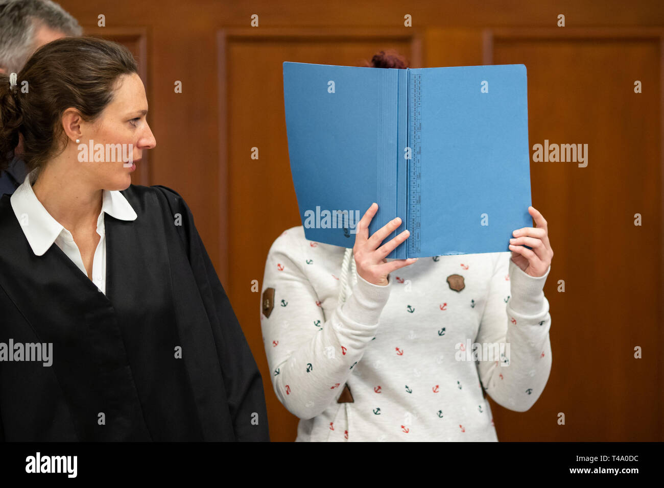 15 April 2019, Bavaria, Nürnberg: The 28-year-old defendant (r) is ...