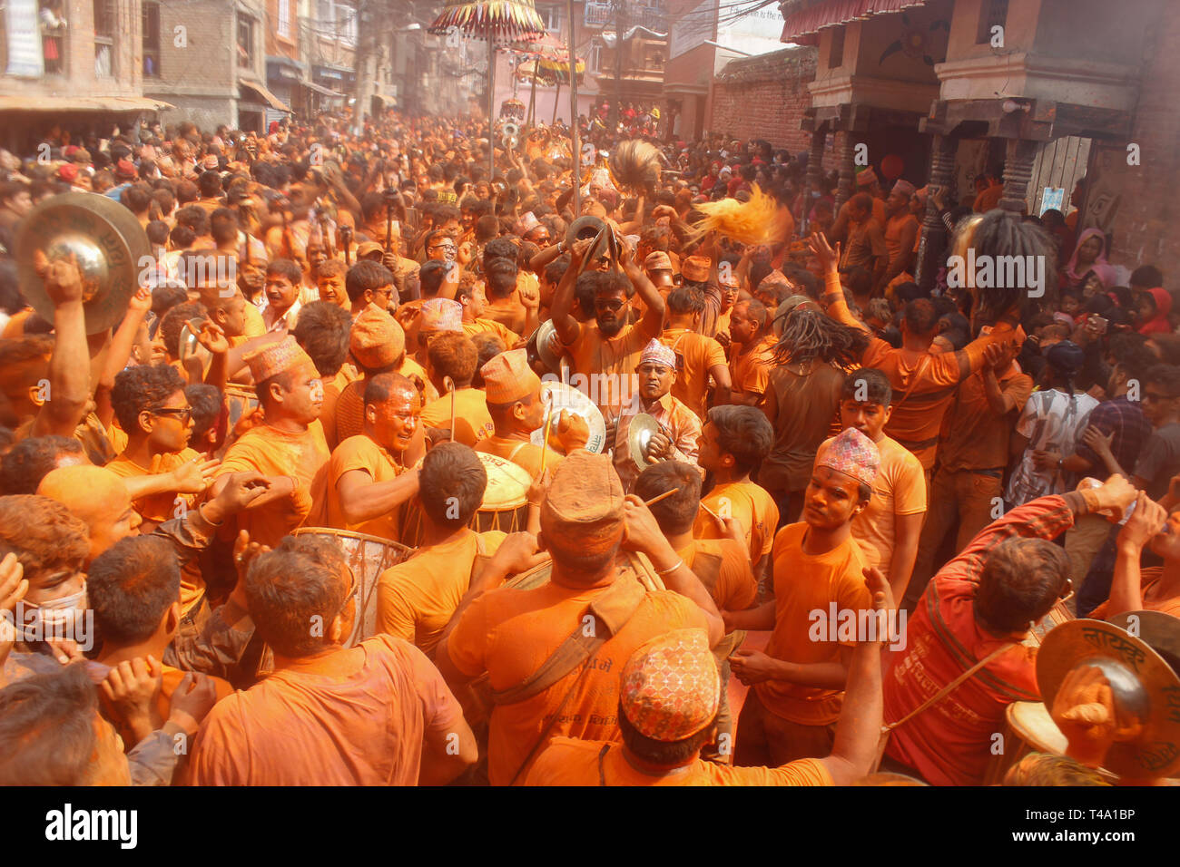 Thimi, Nepal. 15th Apr, 2019. Devotees smeared in vermillion powder ...