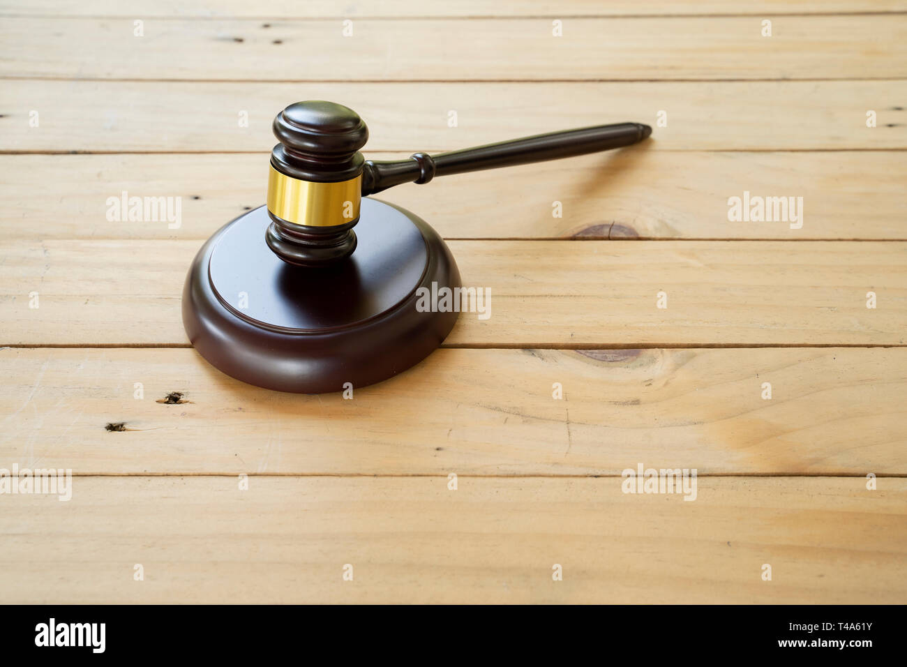 Hammer on the wooden table - picture Stock Photo - Alamy