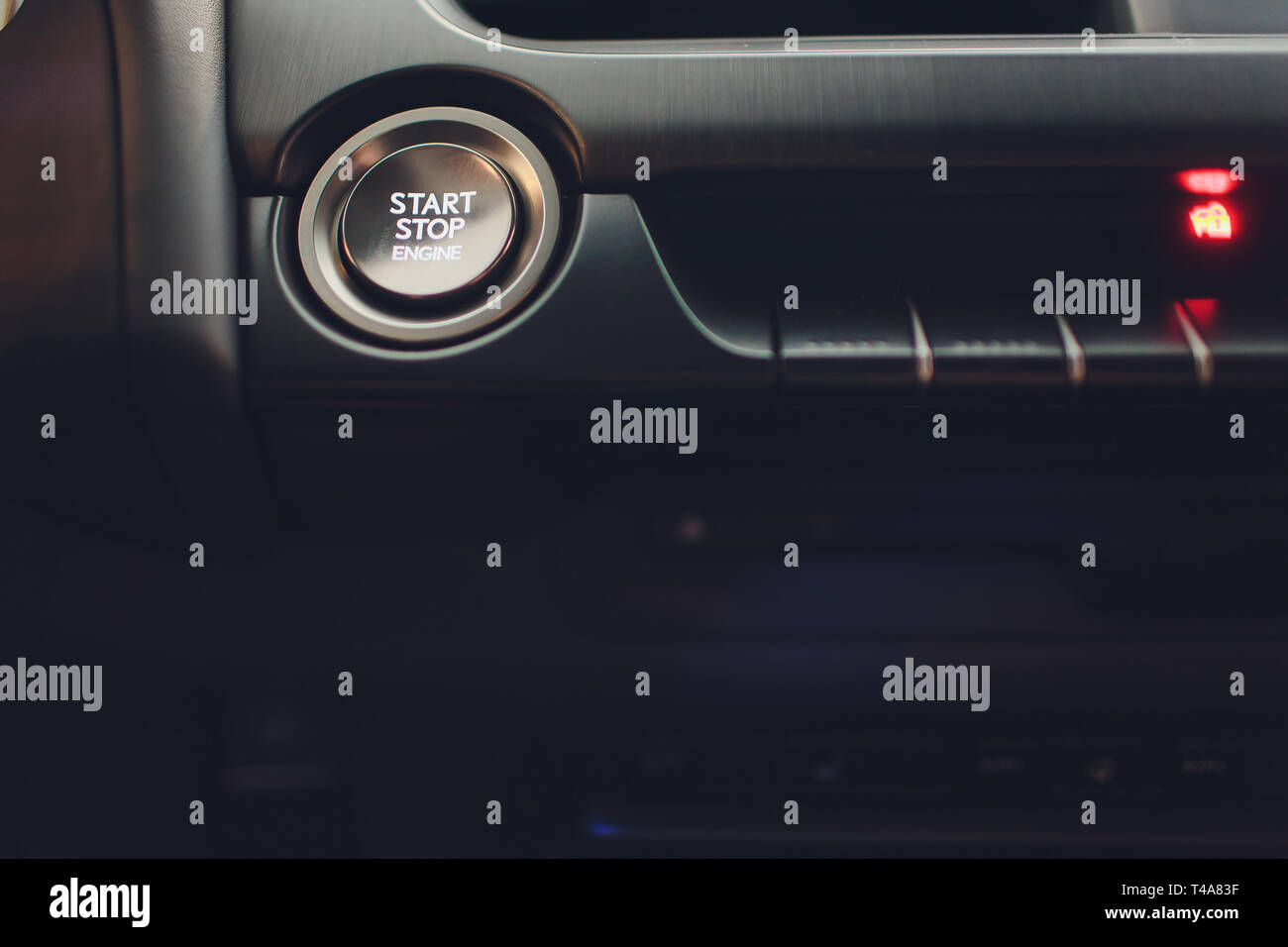 Car driver starting the engine keyless. Black Stock Photo - Alamy