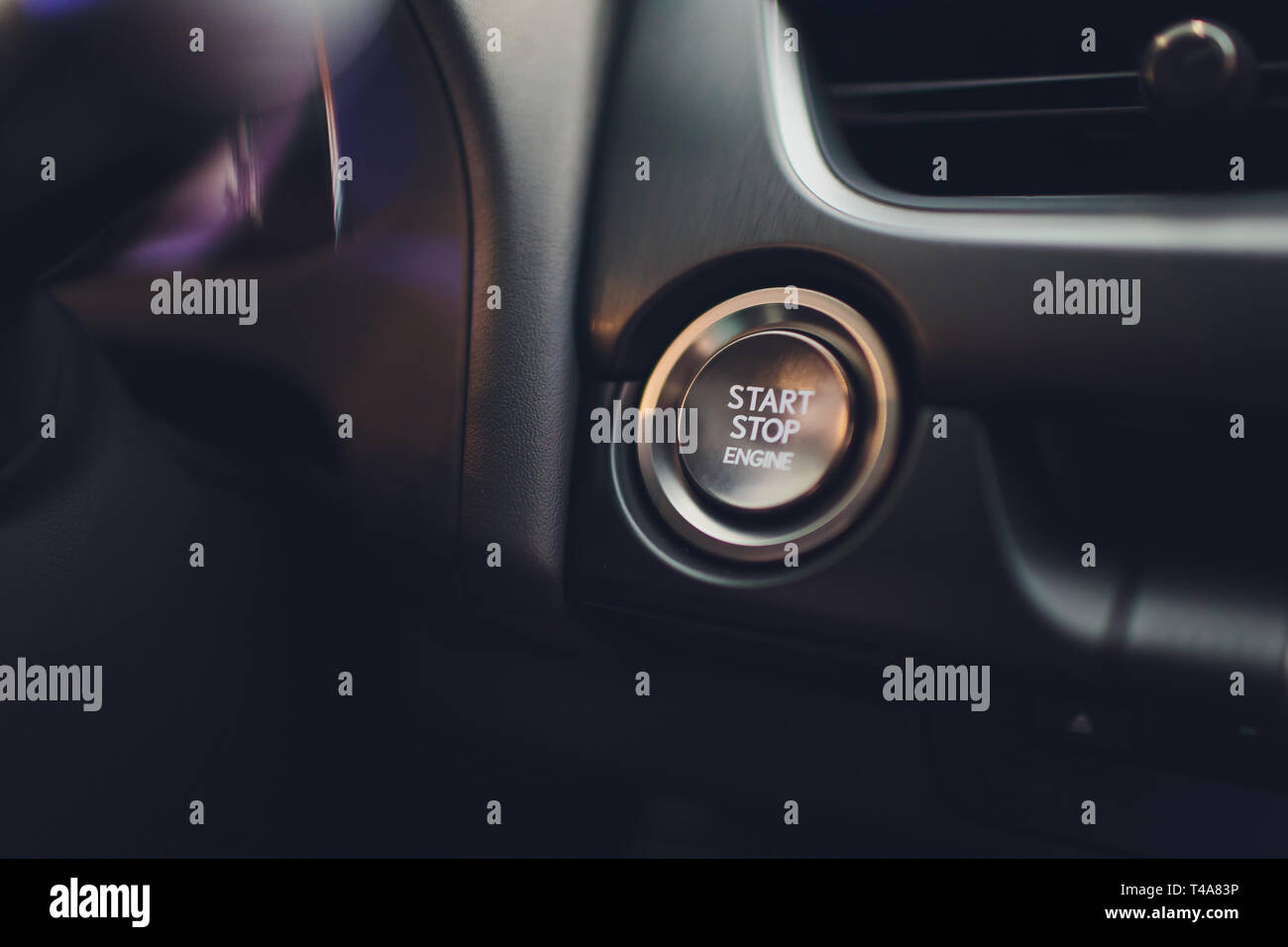 Car driver starting the engine keyless. Black Stock Photo - Alamy