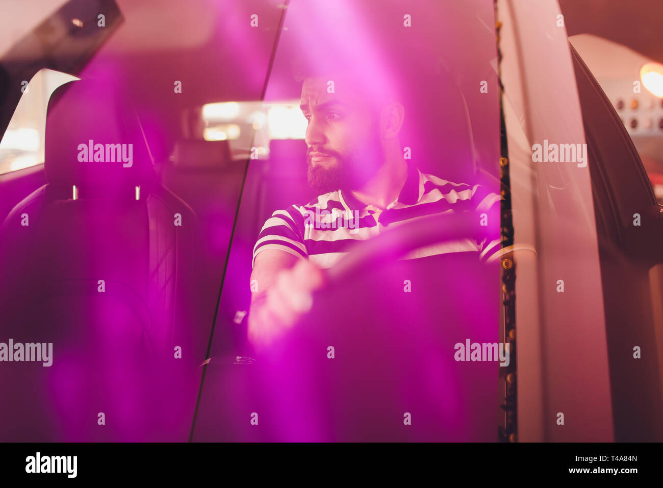 First test drive. Handsome young man ready to make first test drive ...