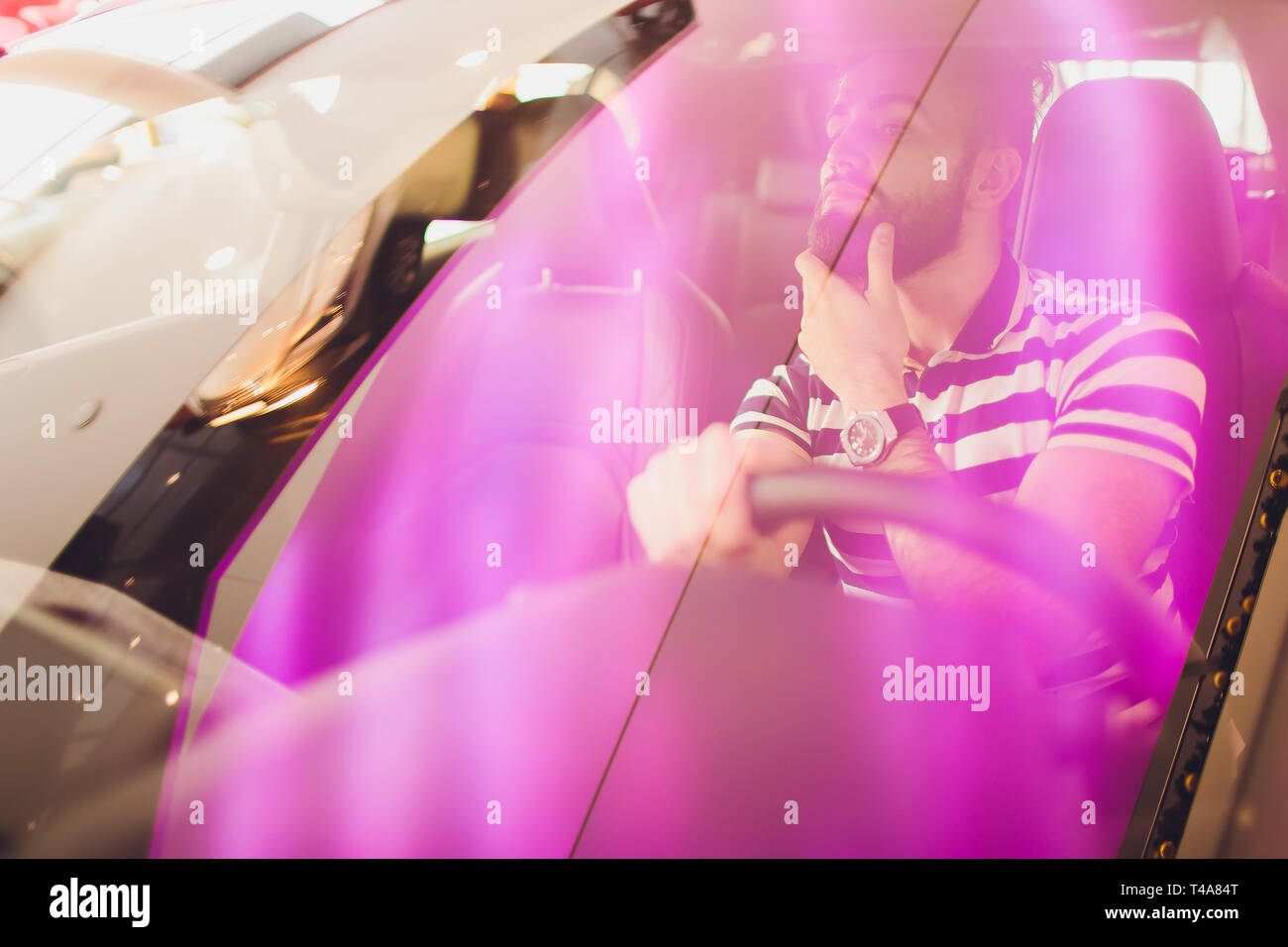 First test drive. Handsome young man ready to make first test drive ...