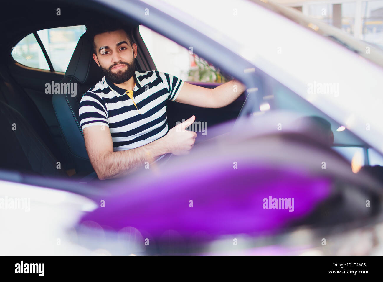 First test drive. Handsome young man ready to make first test drive ...