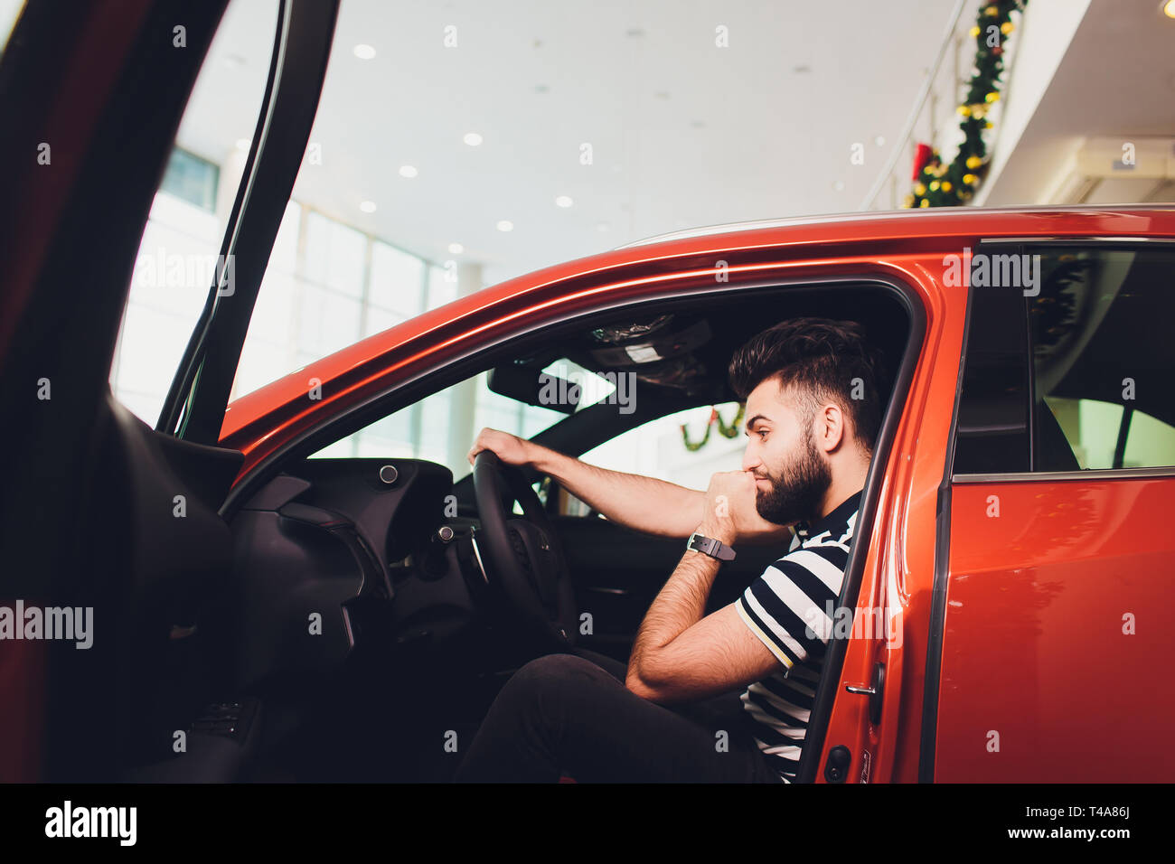 First test drive. Handsome young man ready to make first test drive ...