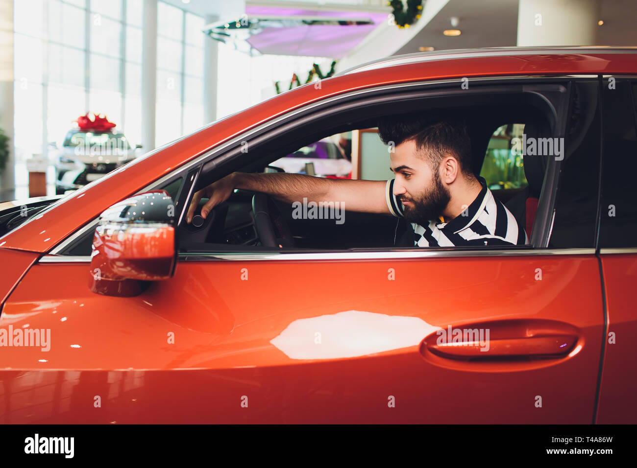 First test drive. Handsome young man ready to make first test drive ...