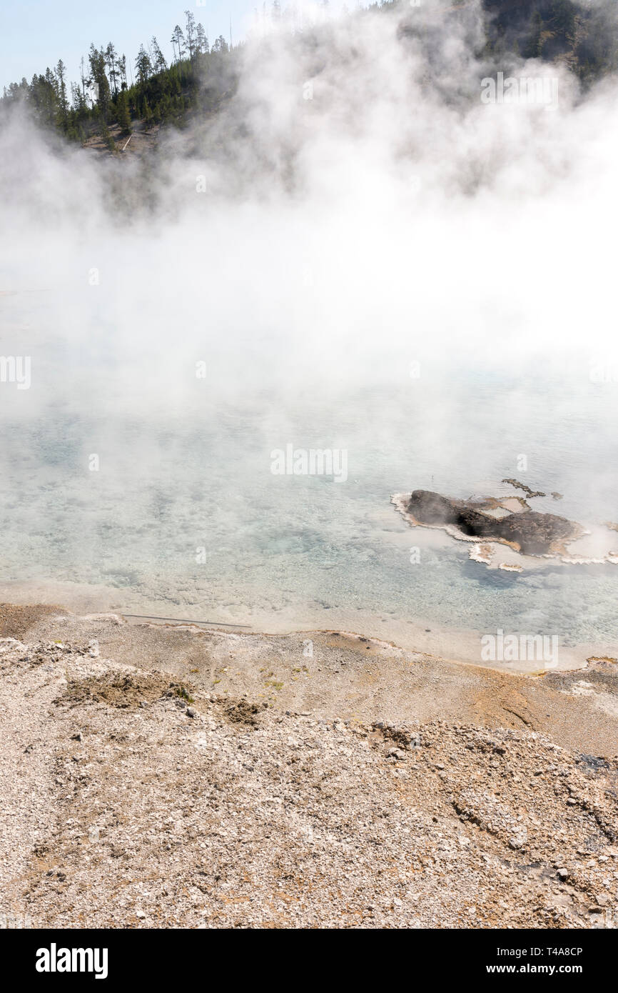 Geyser in grand prismatic spring Basin in Yellowstone National Park in ...