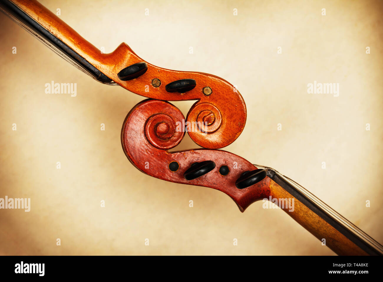 two old violin scrolls detail in ambient light Stock Photo - Alamy