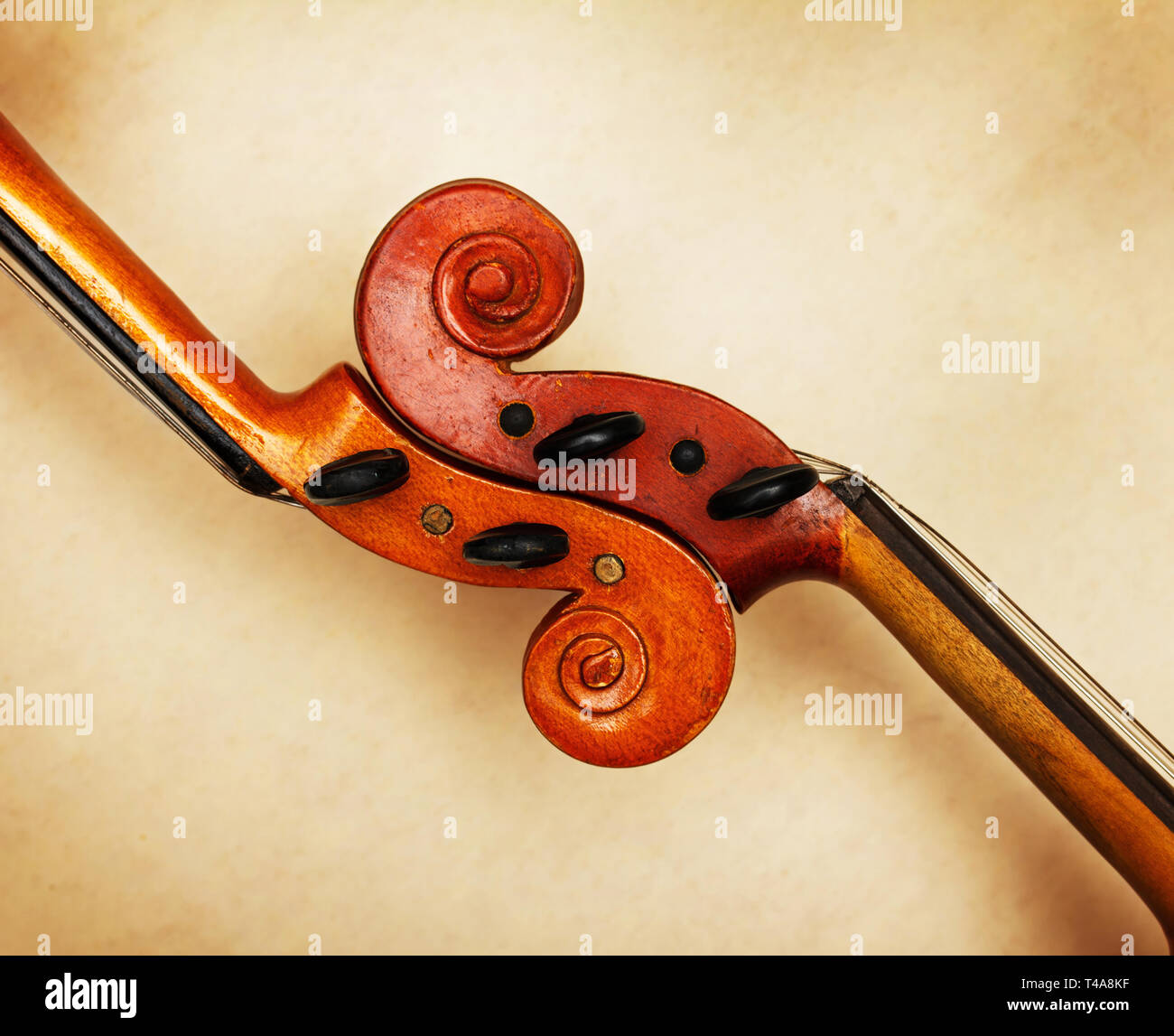 two old violin scrolls detail in ambient light Stock Photo - Alamy