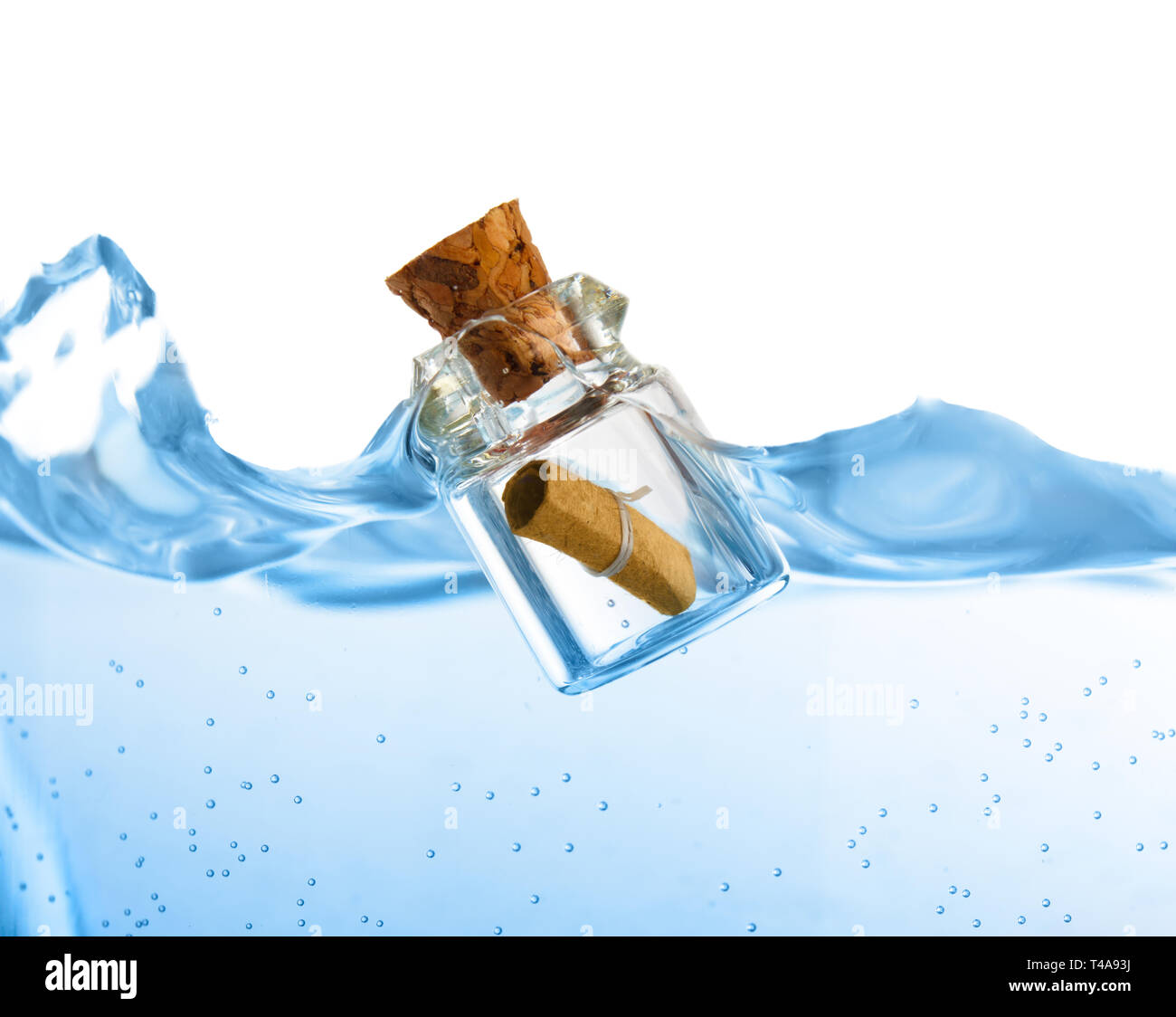 Bottle with message floating in water Stock Photo - Alamy