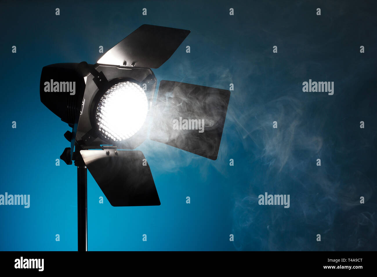 Studio spot light with smoke Stock Photo - Alamy