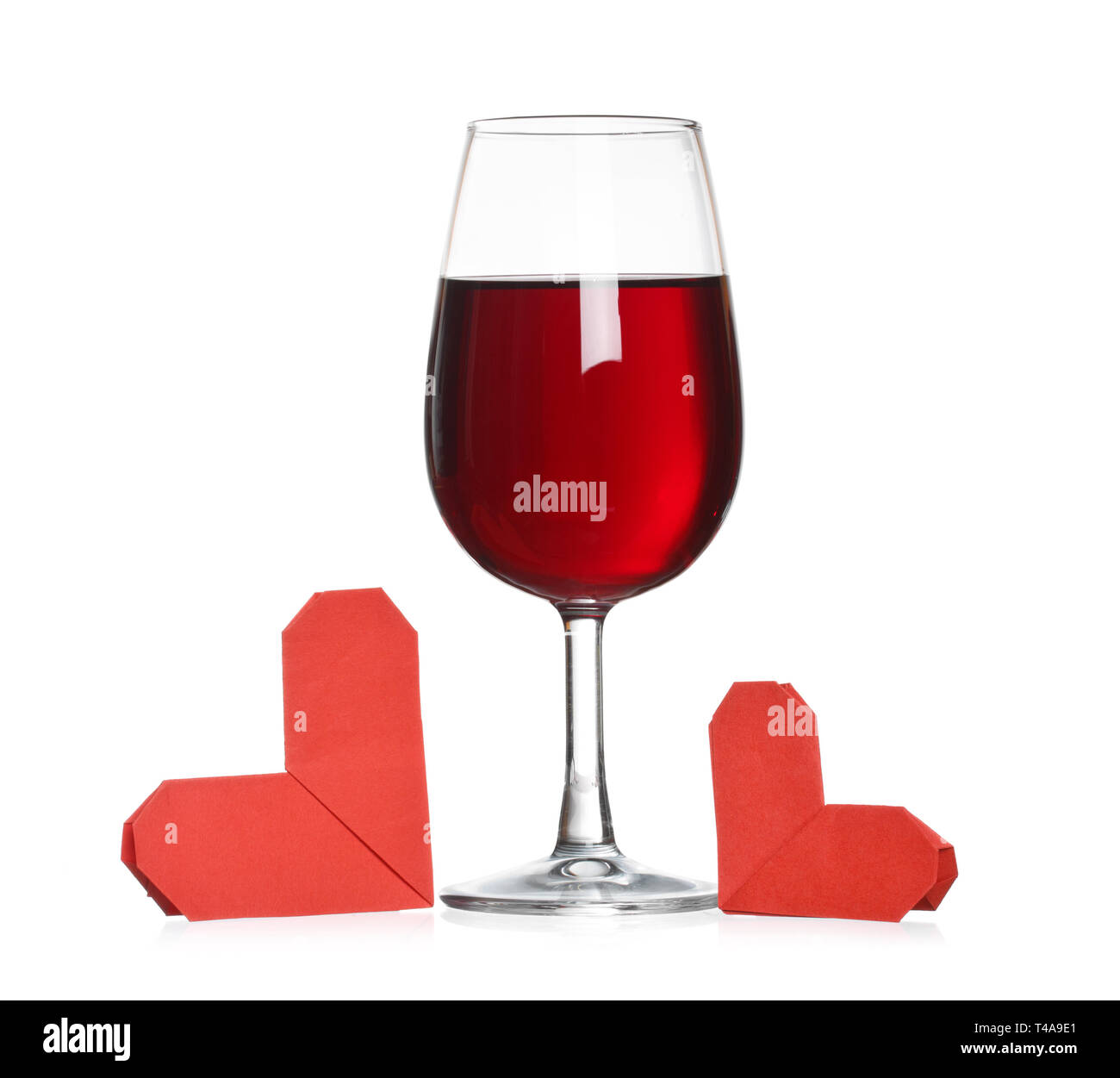 Glass of wine with origami hearts Stock Photo - Alamy