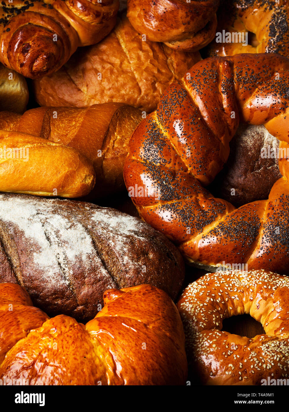 Assortment of baked bread background Stock Photo - Alamy