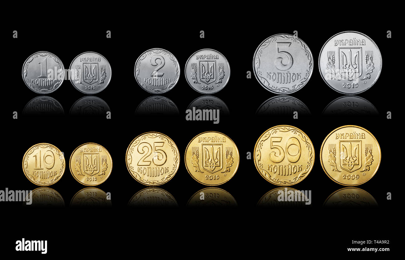 Shiny new Ukrainian coins set front and tail side isolated on black ...