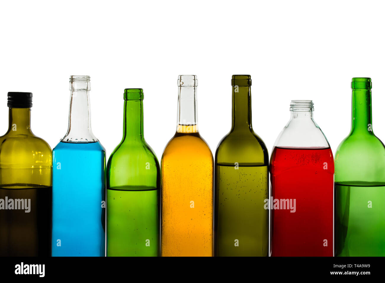 Different alcohol drinks bottles isolated on white Stock Photo - Alamy