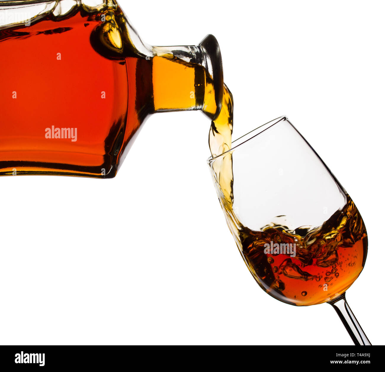 Cognac pouring into the glass Stock Photo - Alamy