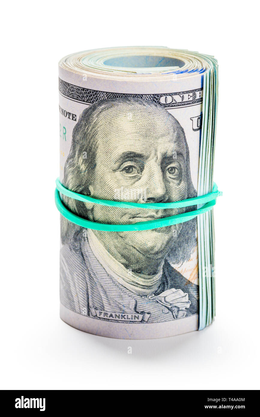 A roll of rolled up 100 dollar bills and tightened by an eraser on a ...